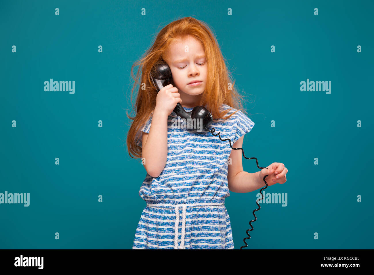Cute beauty little girl in tee shirt with long hair talk a phone Stock ...