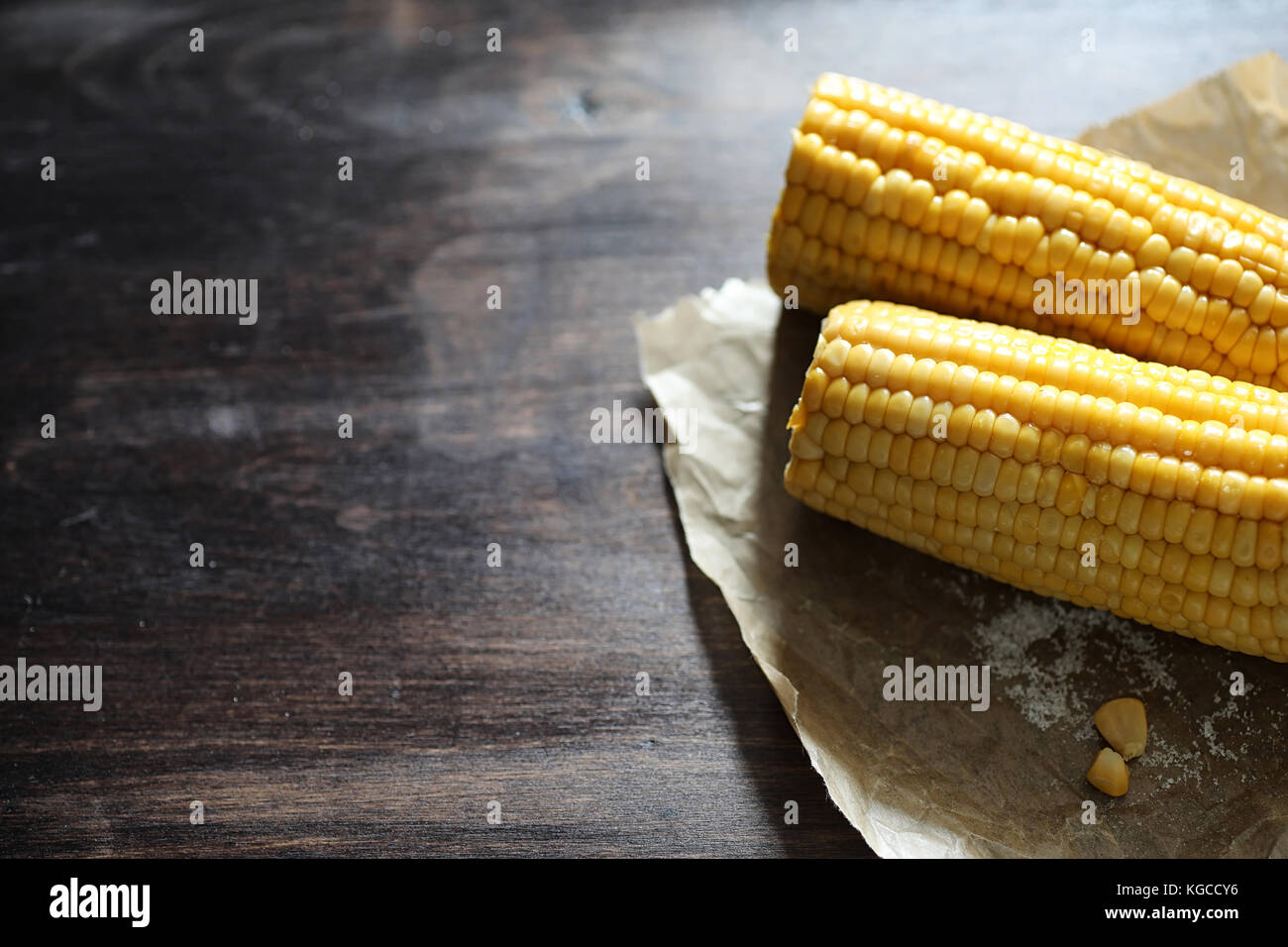 Boiled corn cob with salt on a wood Stock Photo - Alamy
