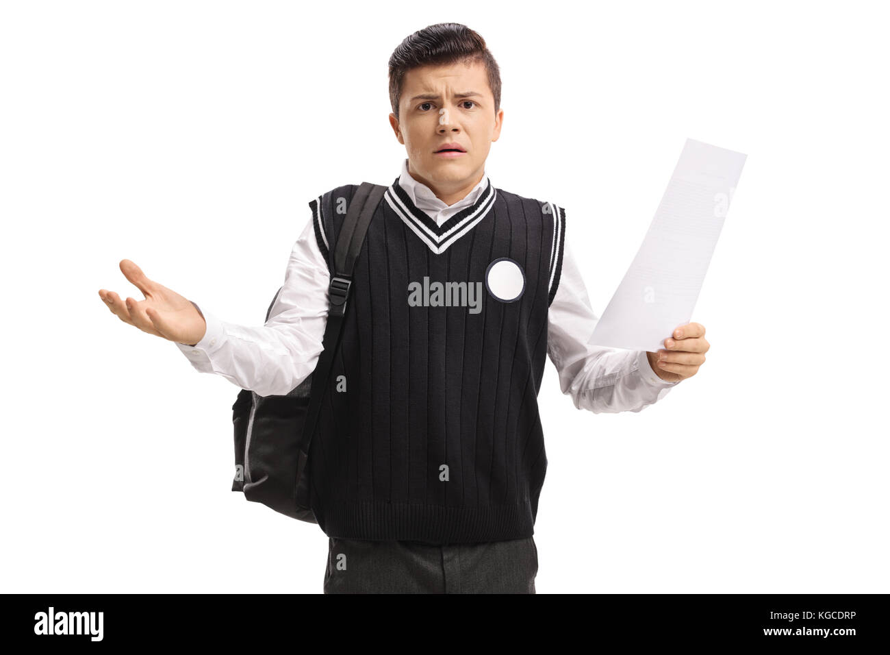 Confused teen student with an exam isolated on white background Stock ...