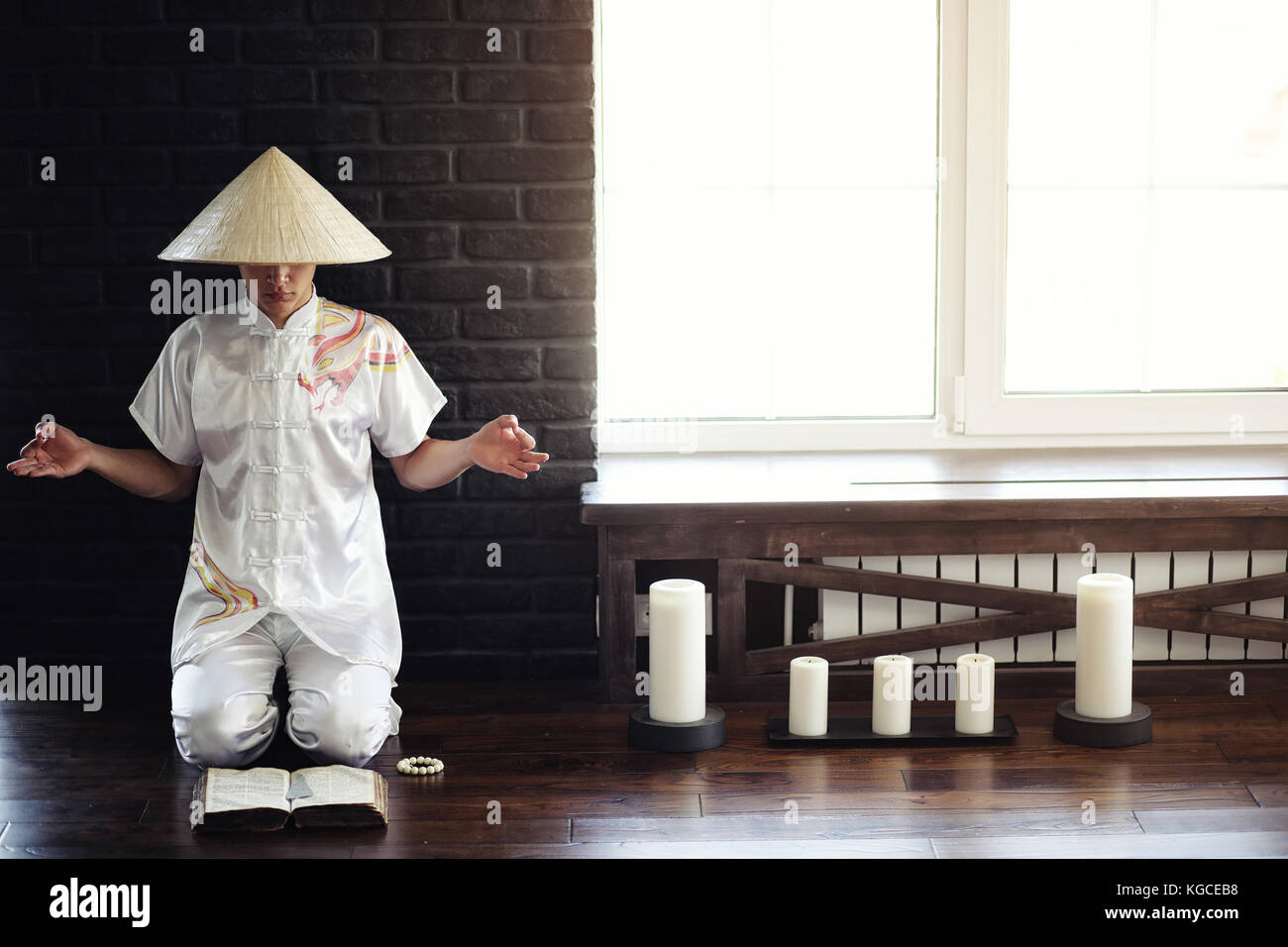 Asian monk reading an old book Stock Photo - Alamy