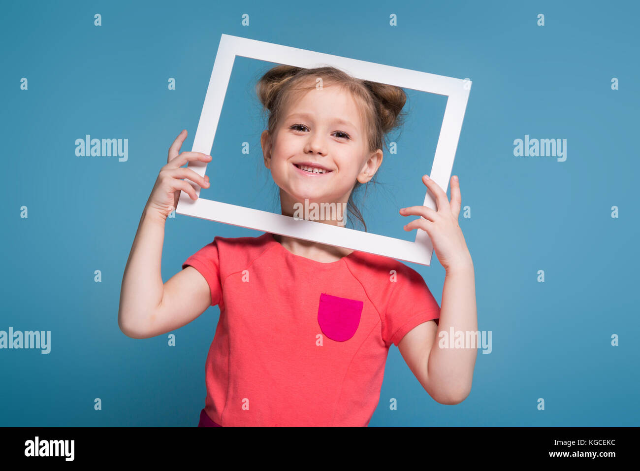 Beautiful cute little girl in pink dress holds picture frame Stock ...