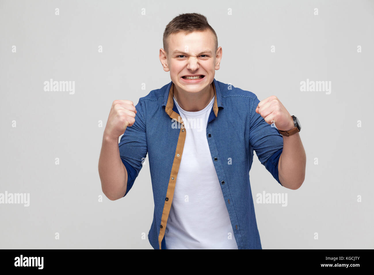 Win concept. Happiness successful boy looking at camera and toothy ...