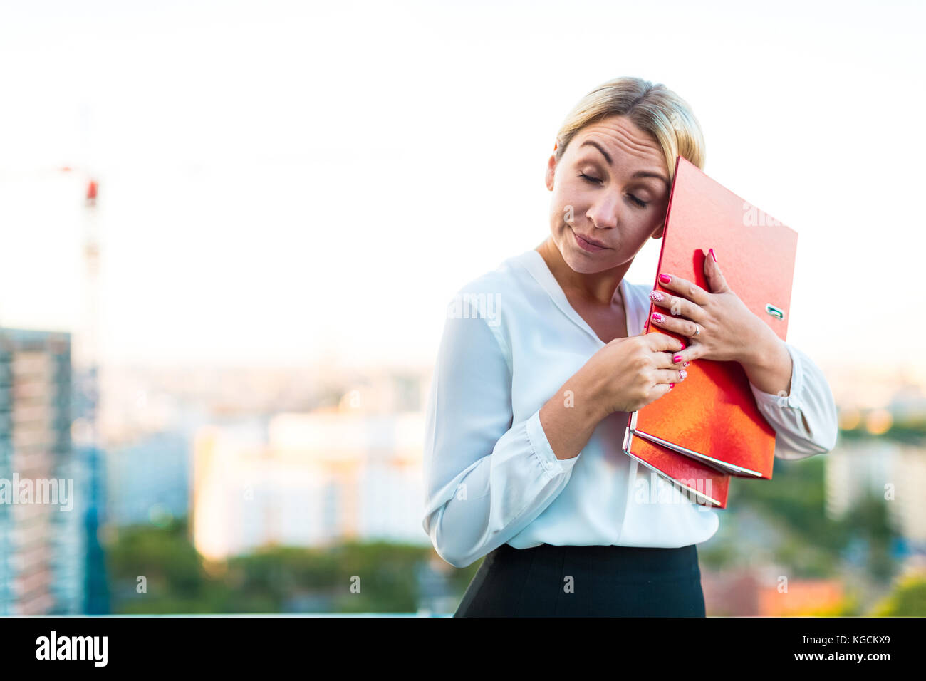 Beautiful smart business lady stand on the roof with paper folde Stock ...