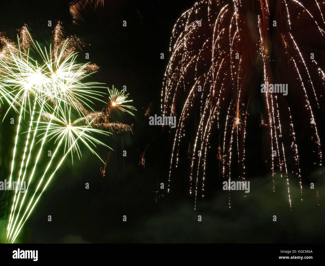 A bunch of smaller fireworks and one big Stock Photo - Alamy