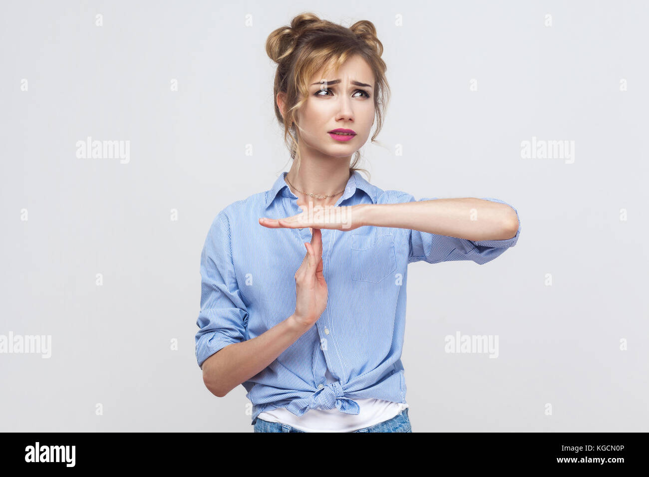 Please break! Time out, stop sign. Young adult blonde girl showing ...
