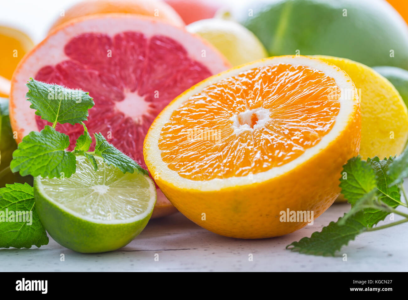 Citrus fresh fruit. Orange grapefruit lemon lime with mint leaves Stock ...