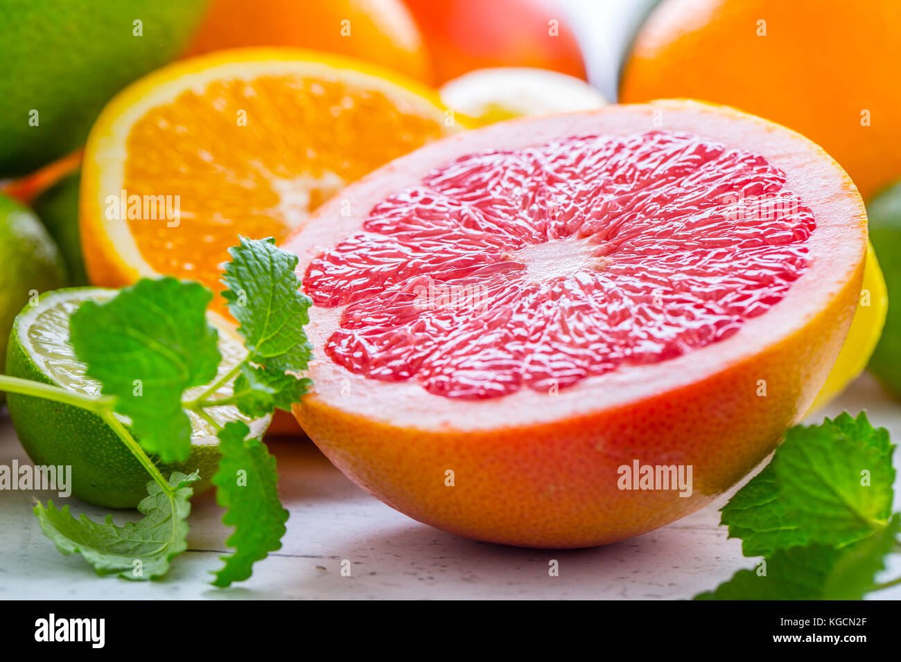Citrus fresh fruit. Orange grapefruit lemon lime with mint leaves Stock ...