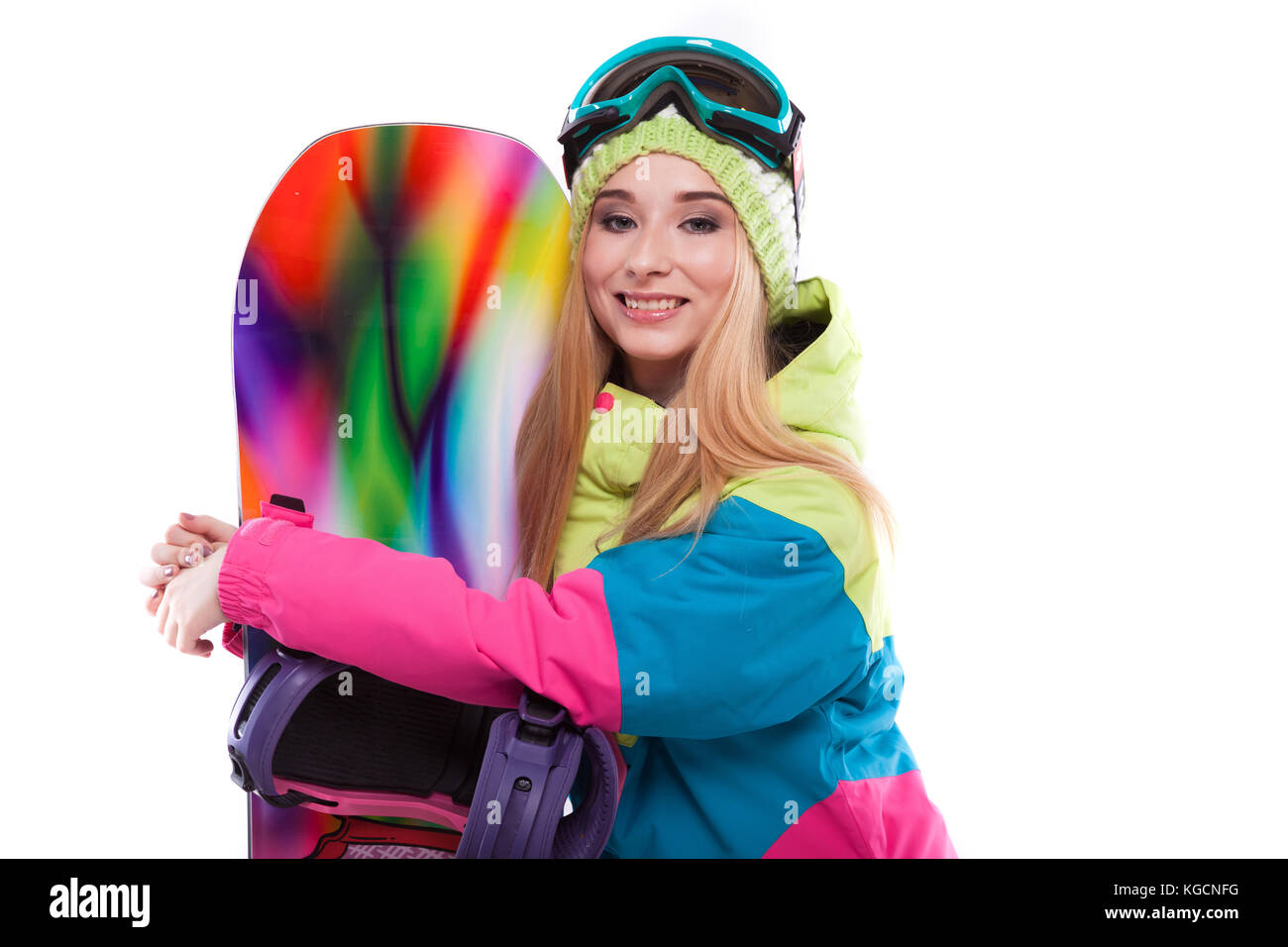 pretty young woman in ski outfit and ski glasses hold snowboard Stock ...