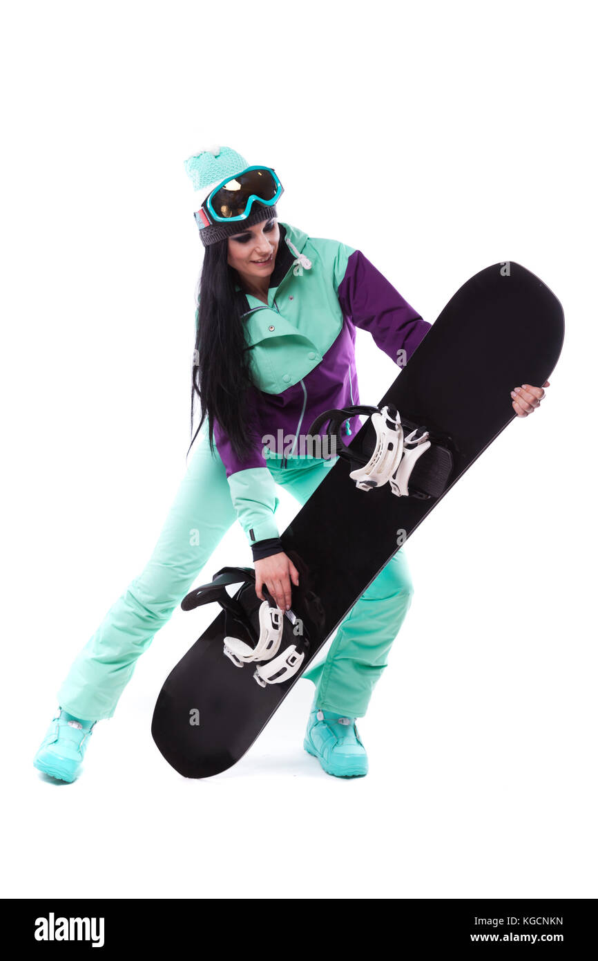 young pretty woman in purple ski costume hold snowboard Stock Photo - Alamy