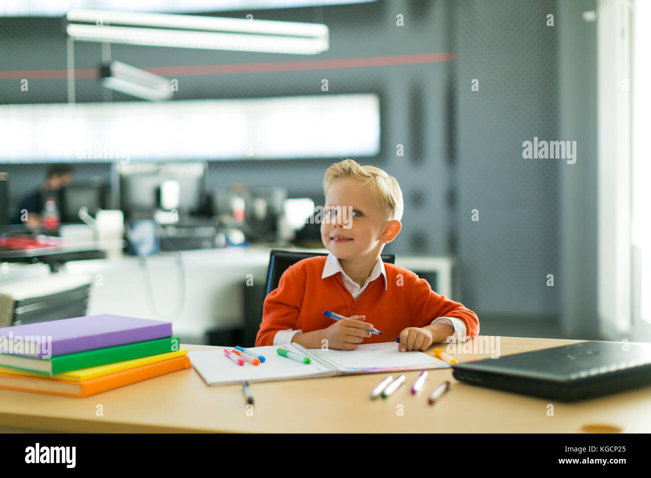 Boy draw in the office Stock Photo - Alamy