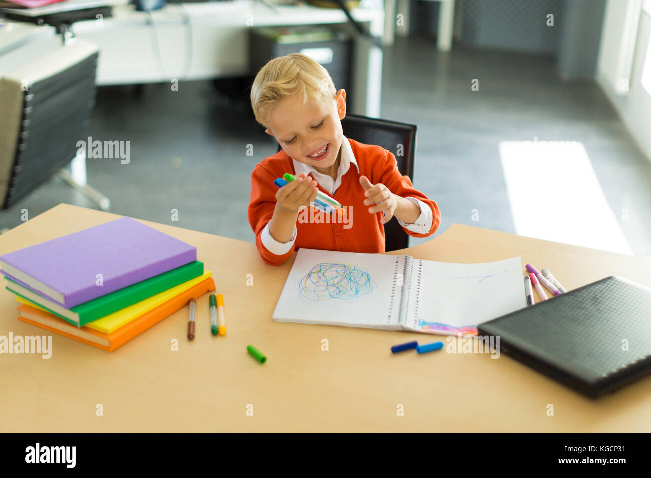 Boy draw in the office Stock Photo - Alamy