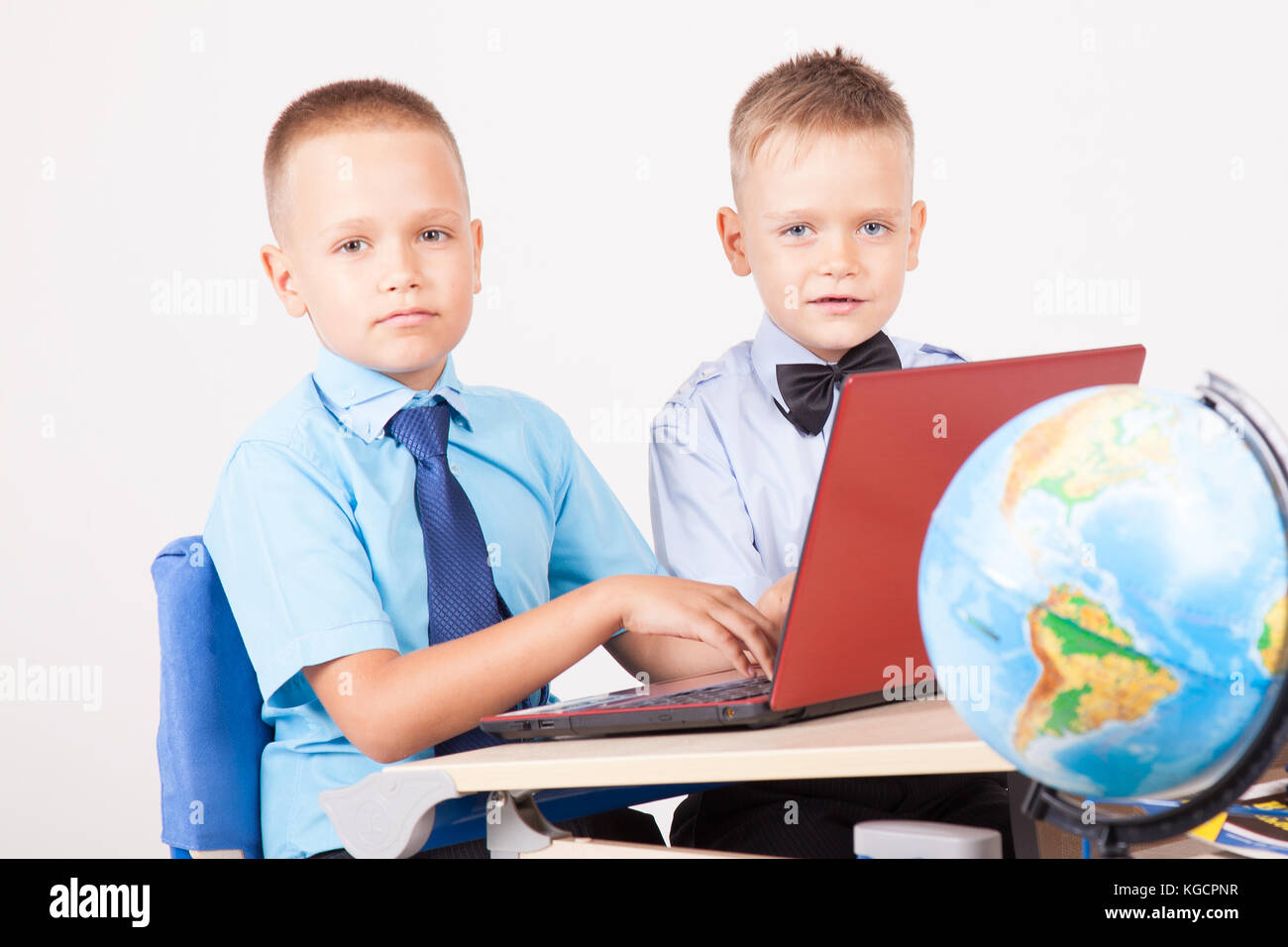 study on the computer two boys at school Stock Photo - Alamy