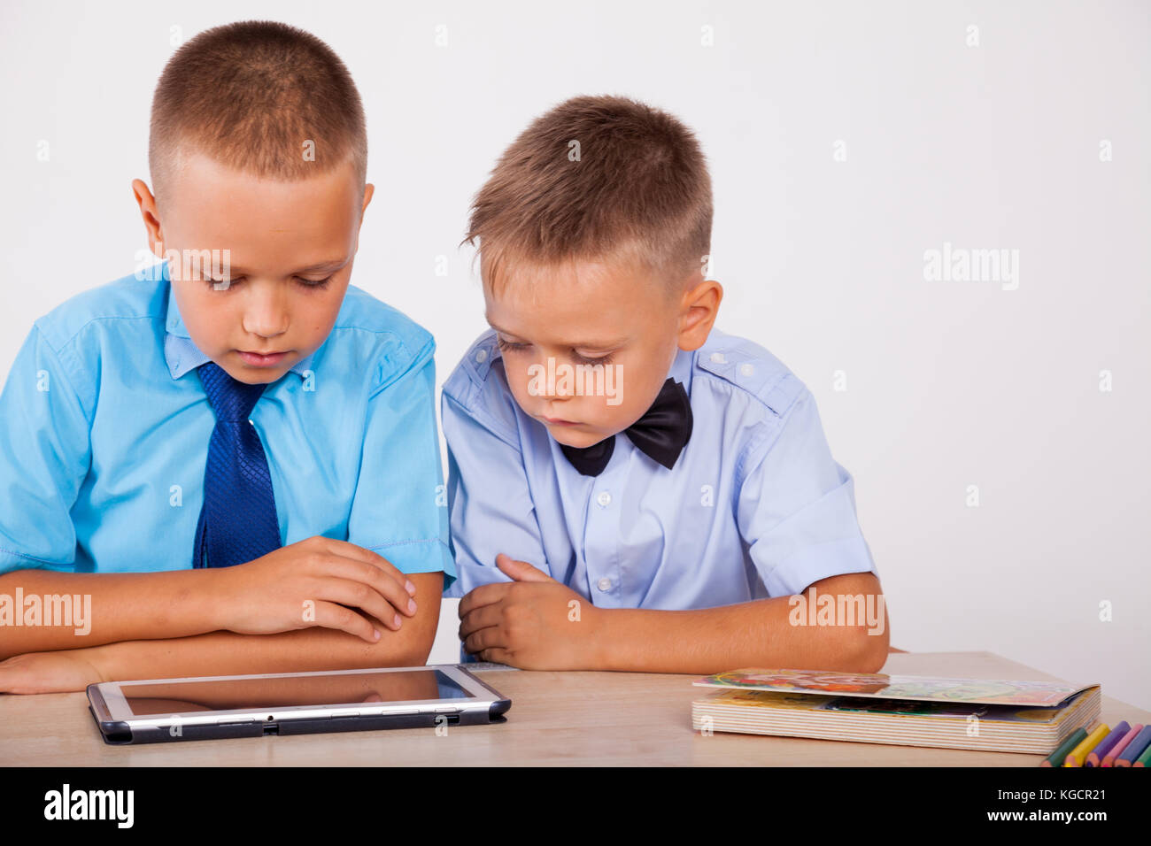 boys learn lessons Internet Tablet Stock Photo - Alamy