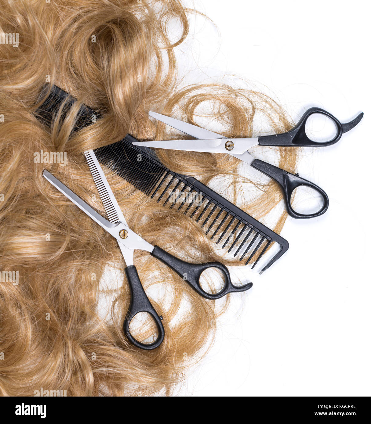 Hairdressing scissors with blonde hair. Isolated background Stock Photo ...