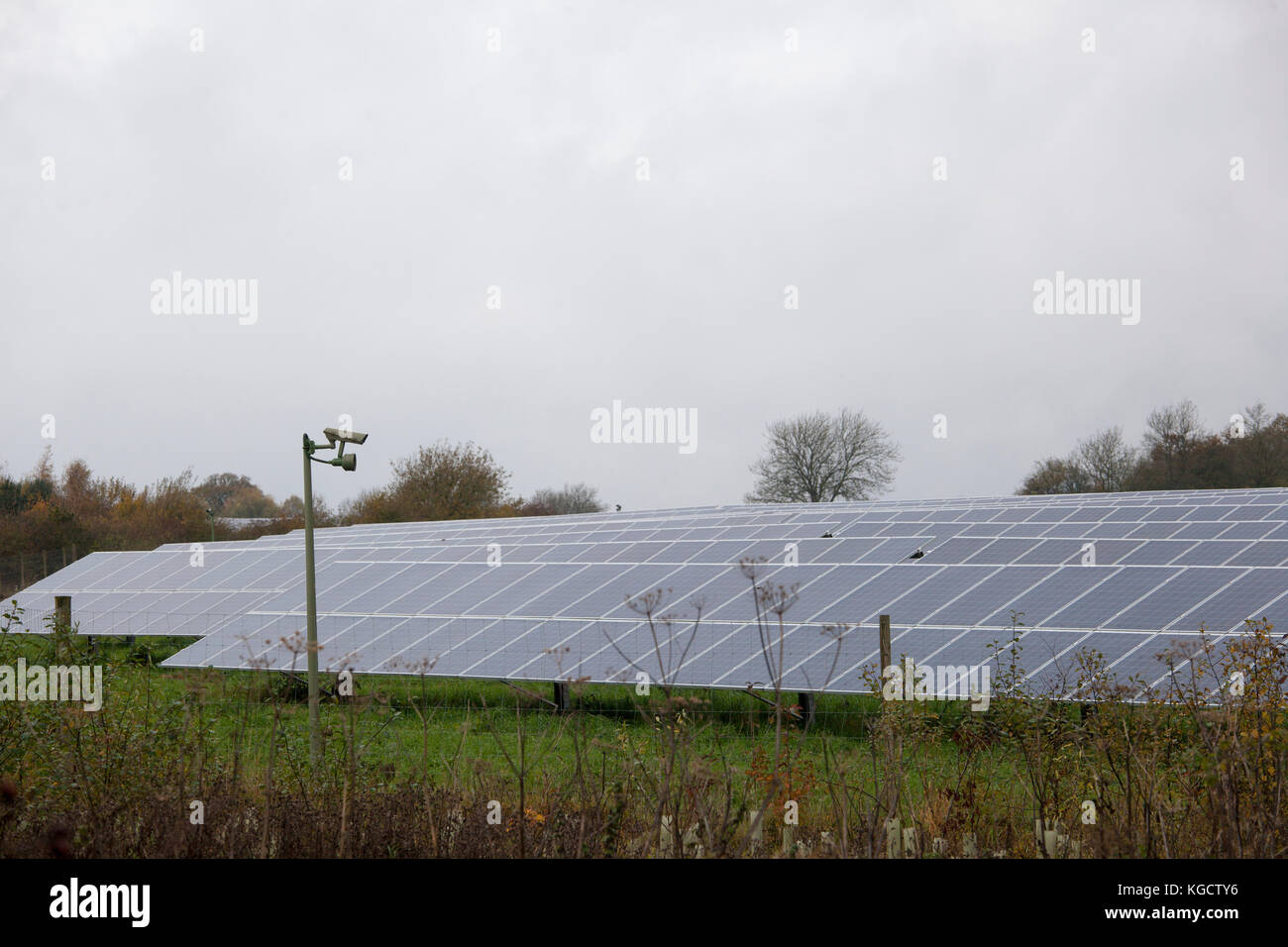solar panels on a solar farm in dull, cloudy light Stock Photo - Alamy