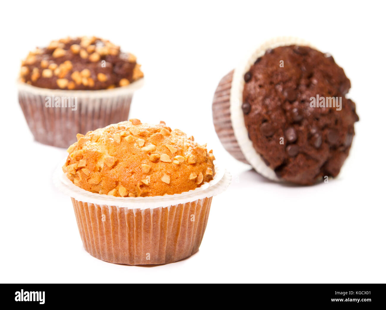 Three muffins on white background Stock Photo - Alamy