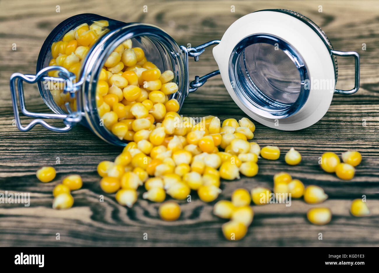 Beautiful detail of boiled corn spilled on wooden table. Tasty and ...