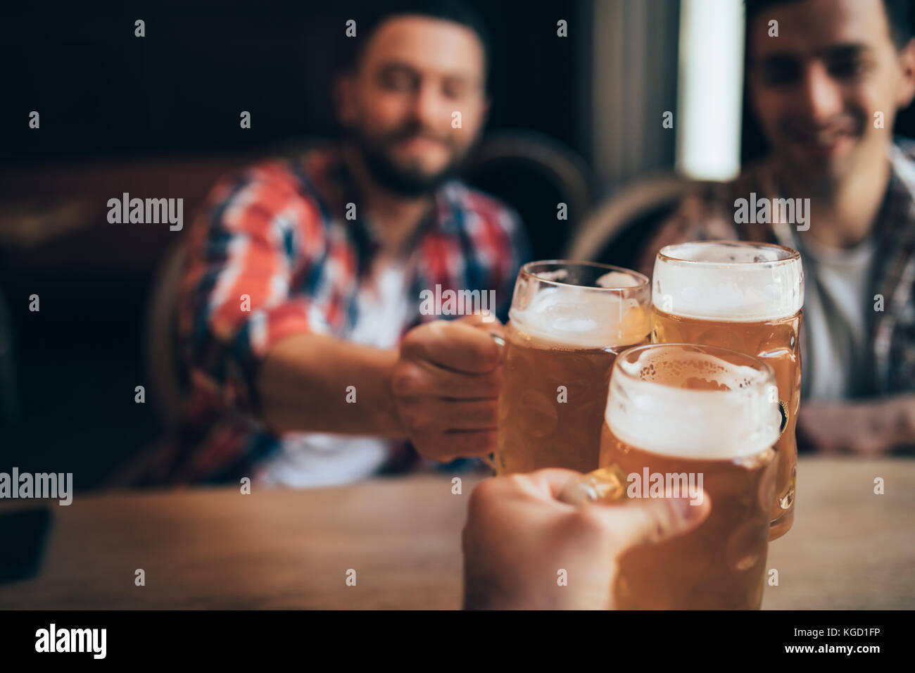 Hands Hold Beverage Beers Bottle Cheers in pub Stock Photo - Alamy