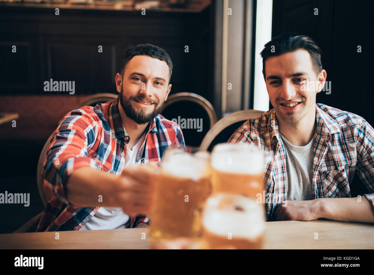Hands Hold Beers High Resolution Stock Photography and Images - Alamy