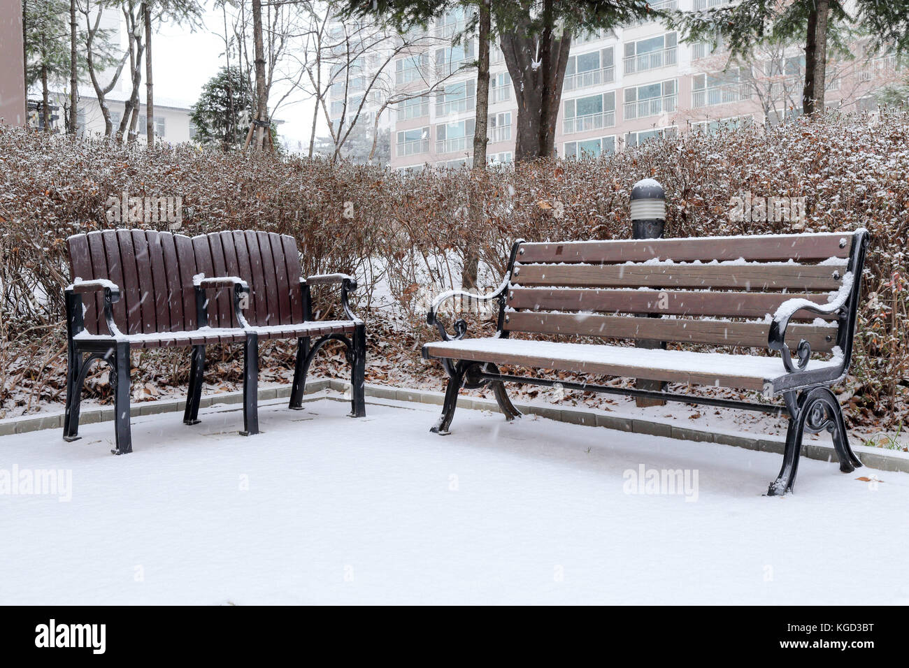 benches in a cold and snowy morning in a residential complex, South ...