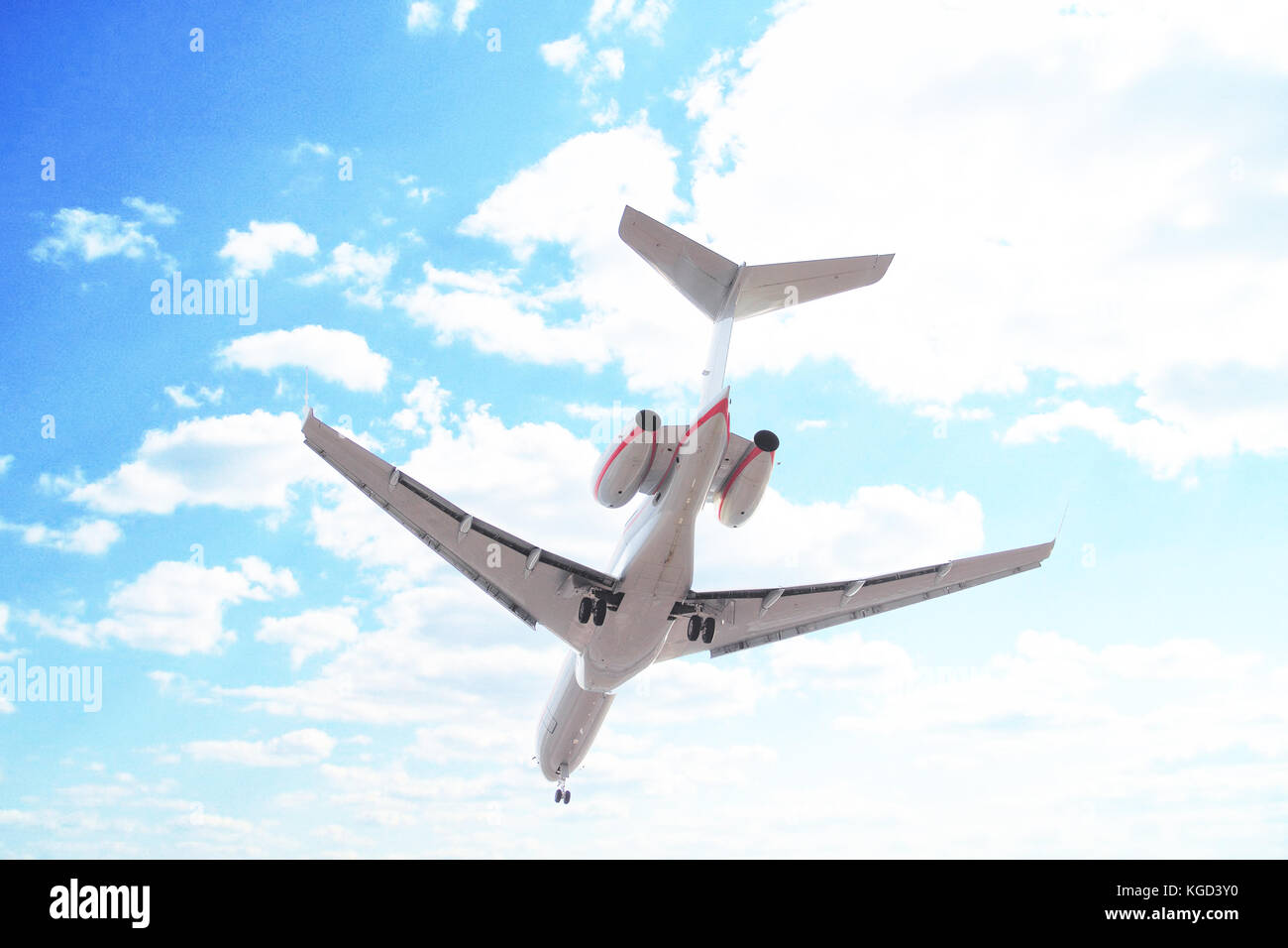 Plane flying through clouds in the sky. Jet aircraft in the air Stock ...