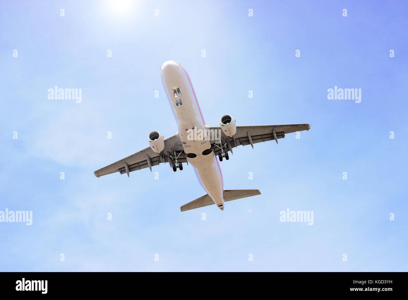 Plane flying through clouds in the sky. Jet aircraft in the air Stock ...