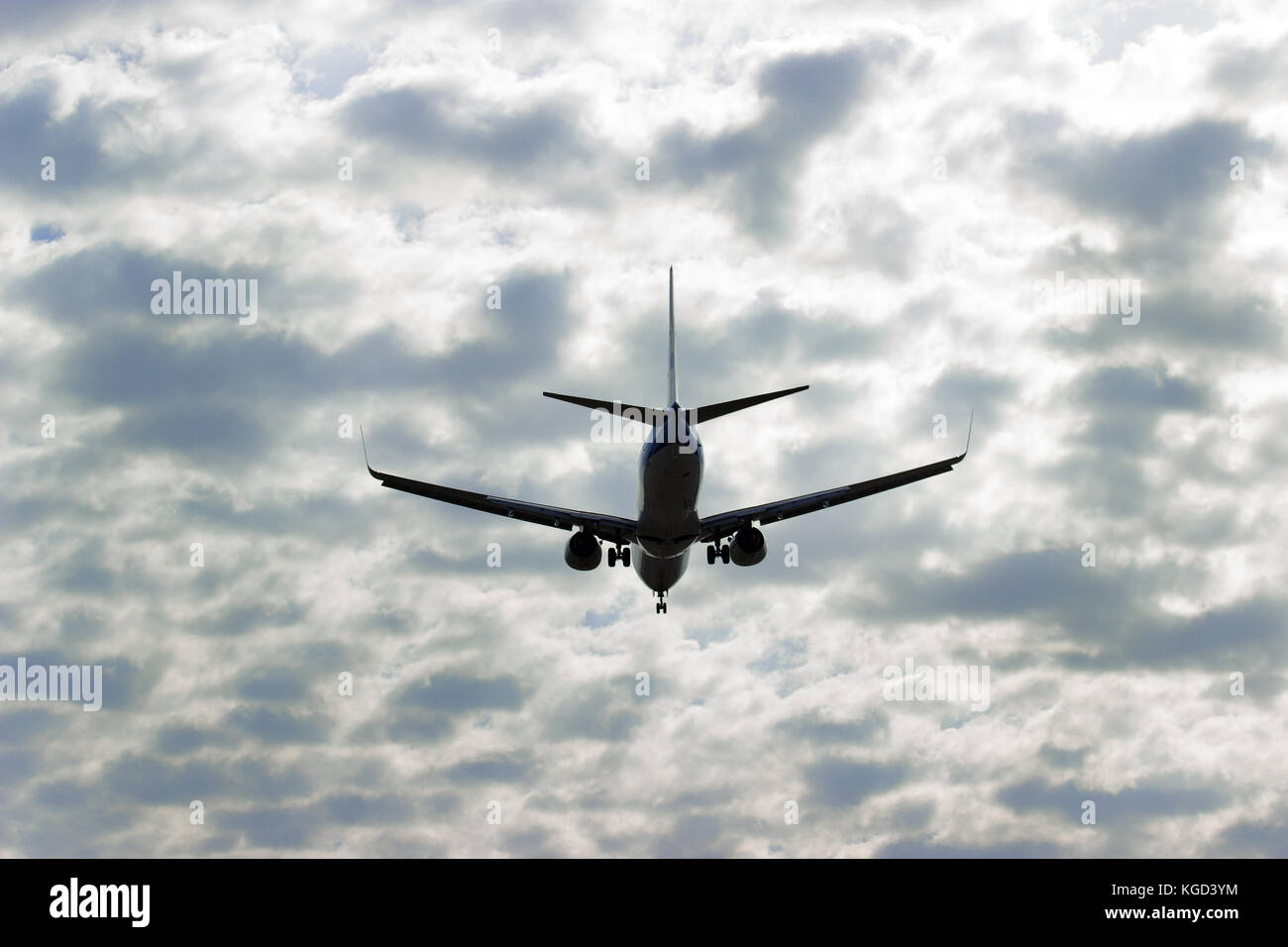 Plane flying through clouds in the sky. Jet aircraft in the air Stock ...