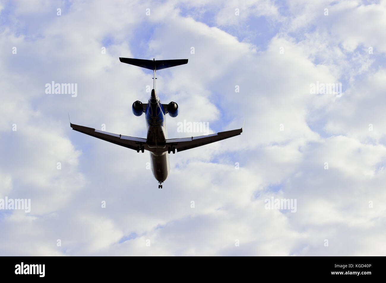 Plane flying through clouds in the sky. Jet aircraft in the air Stock ...