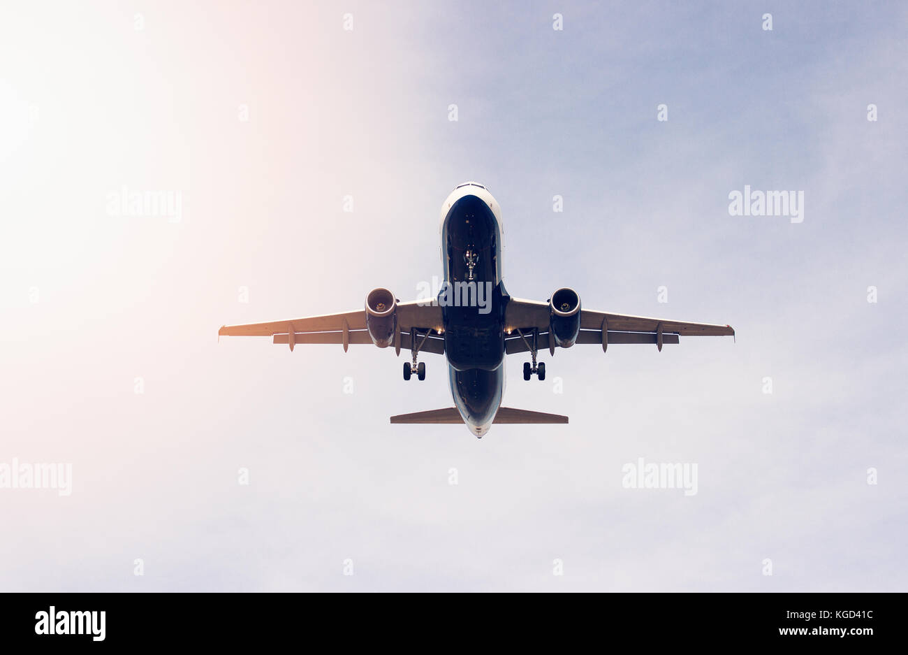 Plane flying through clouds in the sky. Jet aircraft in the air Stock ...