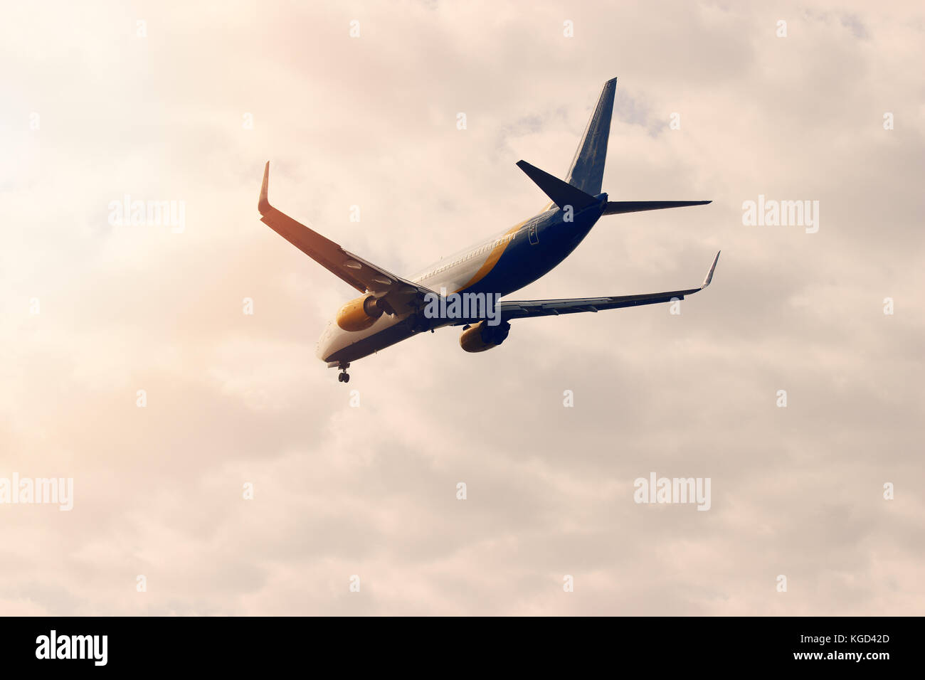 Plane flying through clouds in the sky. Jet aircraft in the air Stock ...