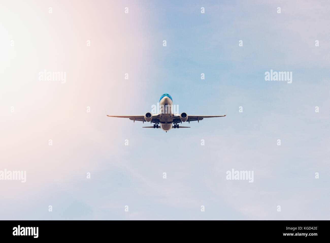 Plane flying through clouds in the sky. Jet aircraft in the air Stock ...