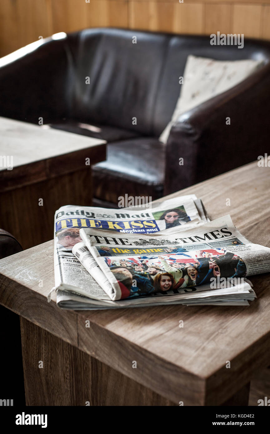 Newspapers on a table Stock Photo - Alamy