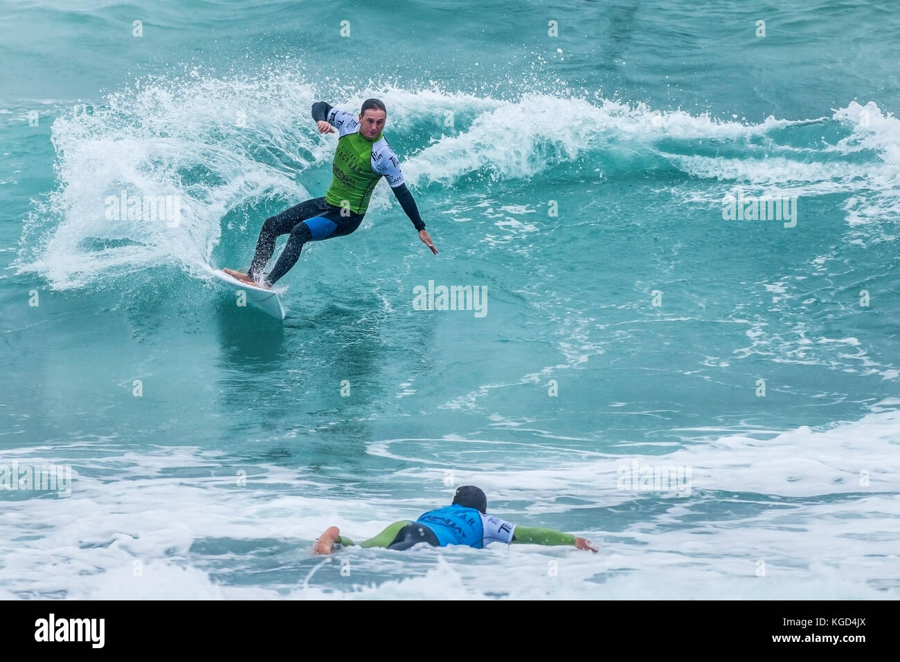 Spectacular surfing action as a surfer rides a wave in a competition at ...