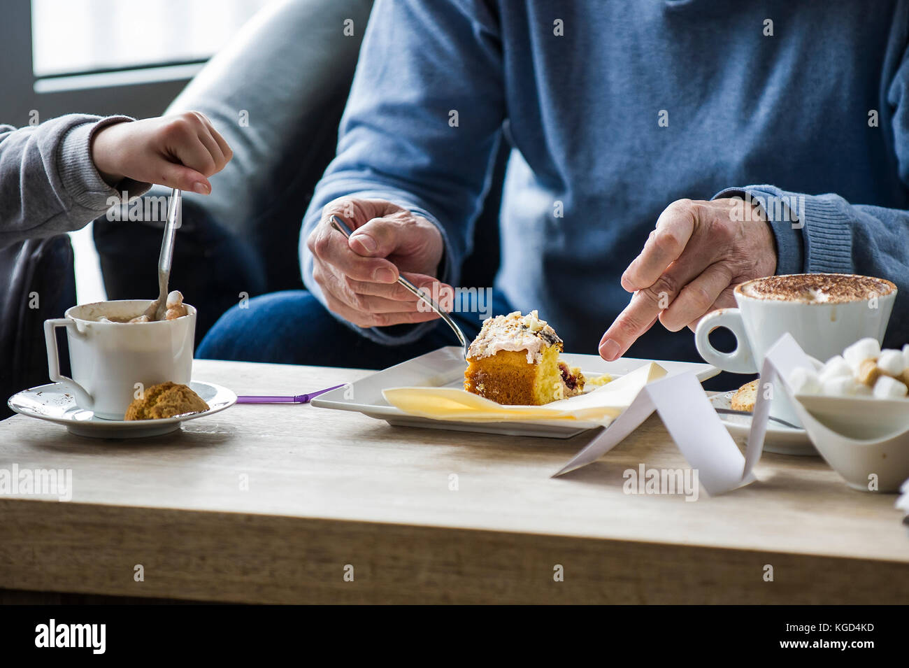 A customer eating cake and drinking coffee Stock Photo - Alamy