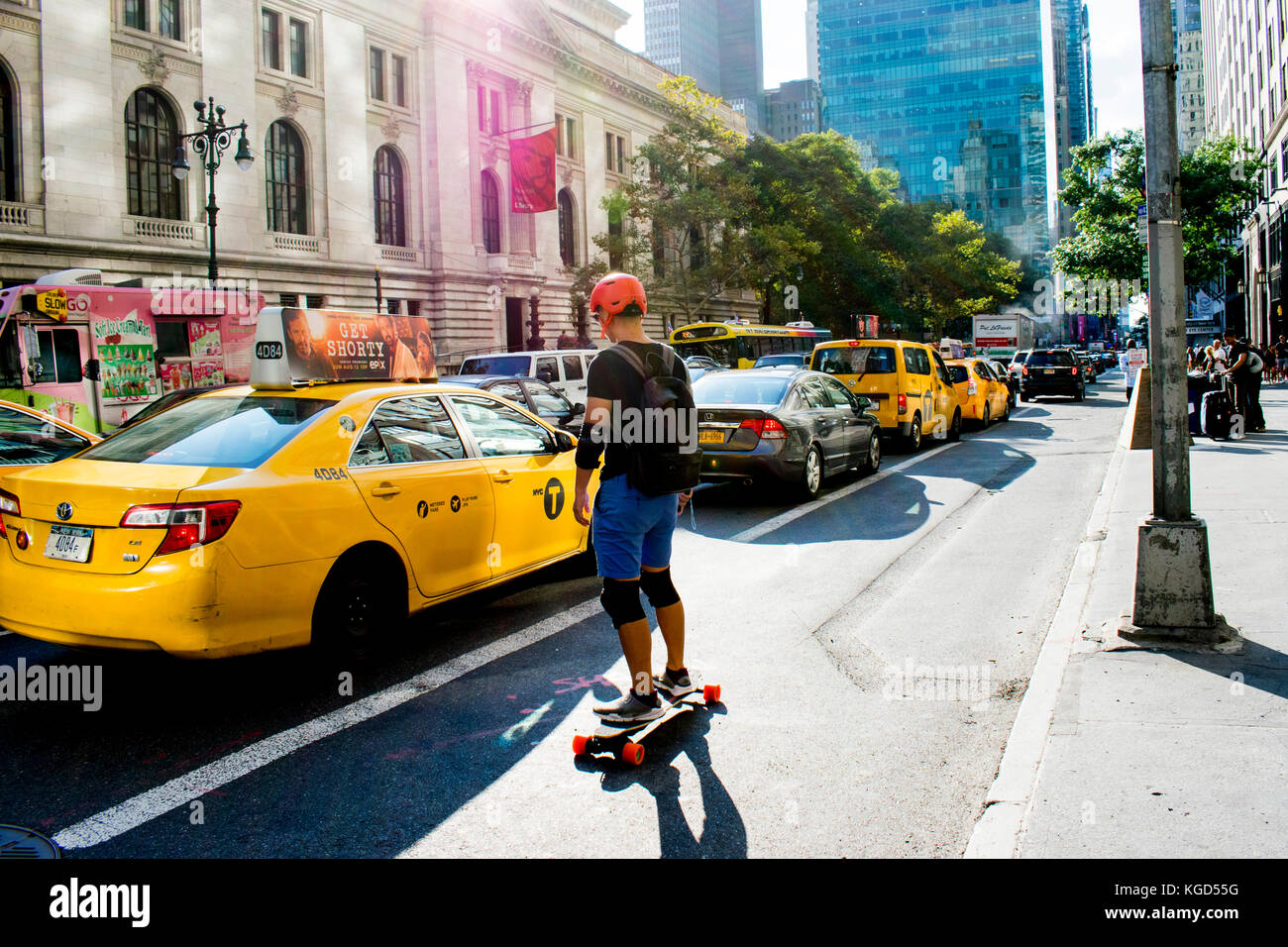 Skateboarder on urban street in Manhattan Stock Photo - Alamy