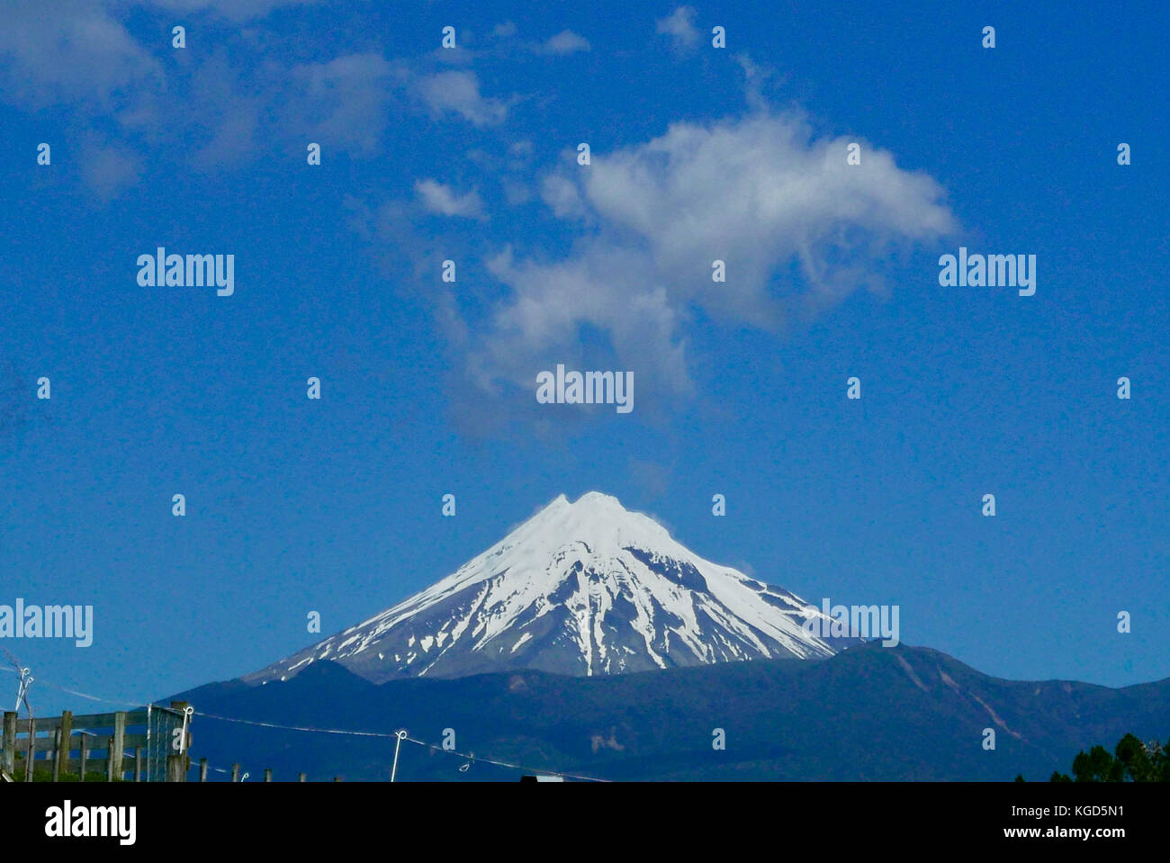 Mt Taranaki in spring snow Stock Photo - Alamy