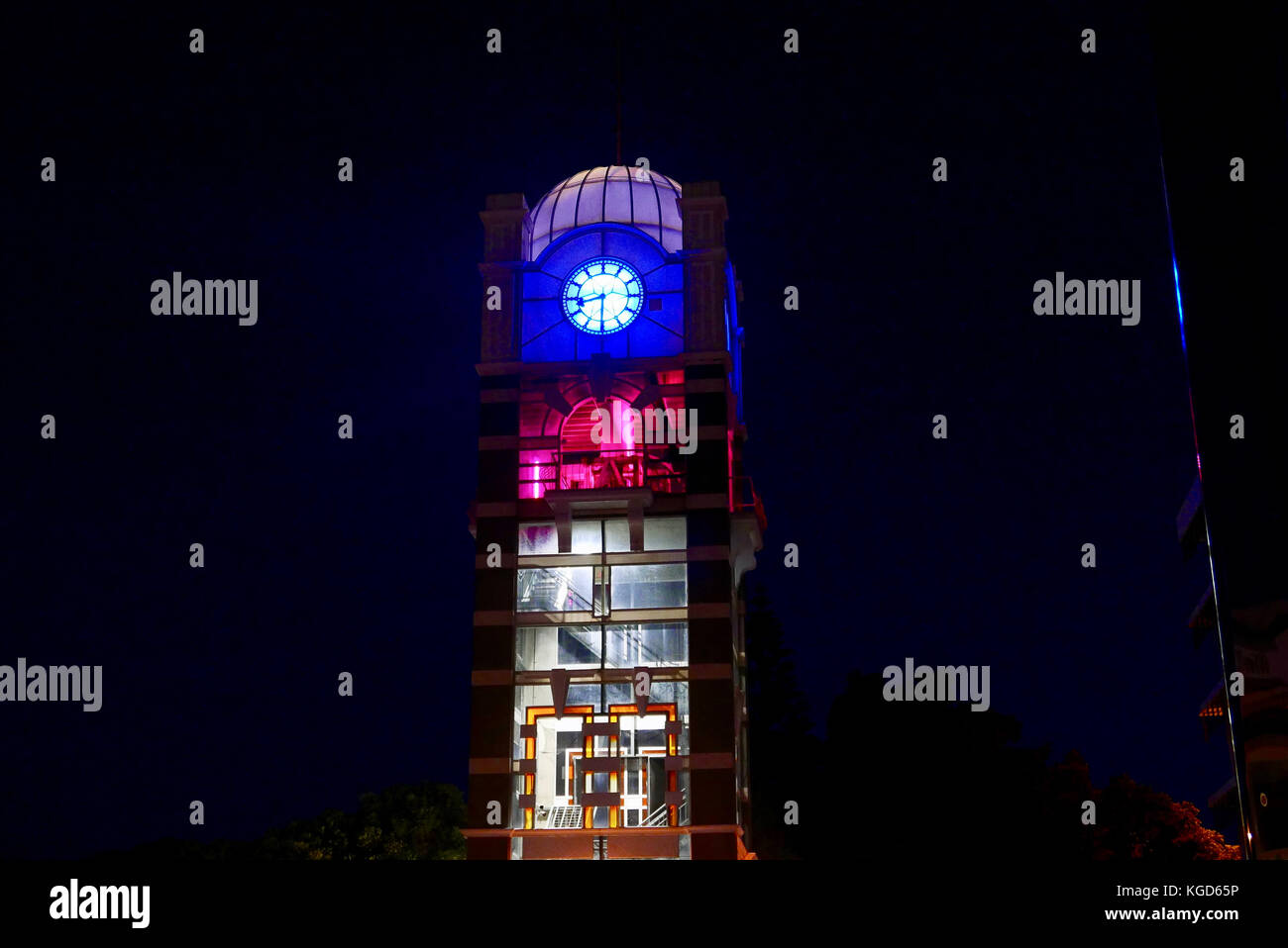 Clock tower illuminated at night Stock Photo - Alamy