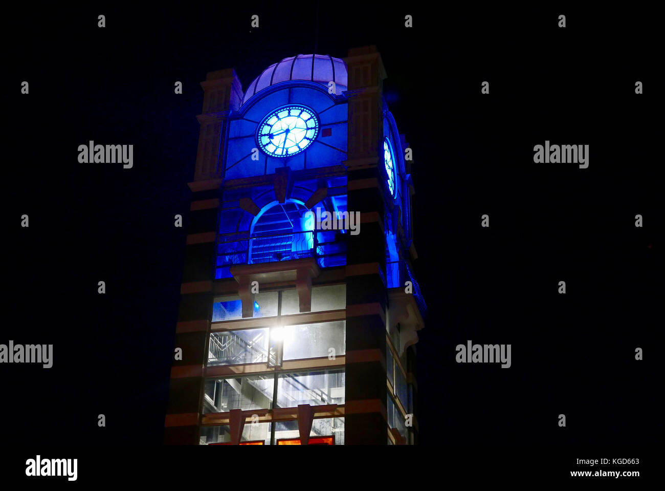 Clock tower illuminated at night Stock Photo - Alamy