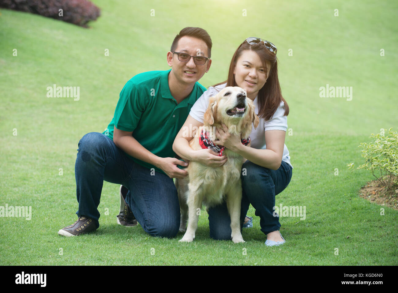asian chinese couple with a dog Stock Photo - Alamy