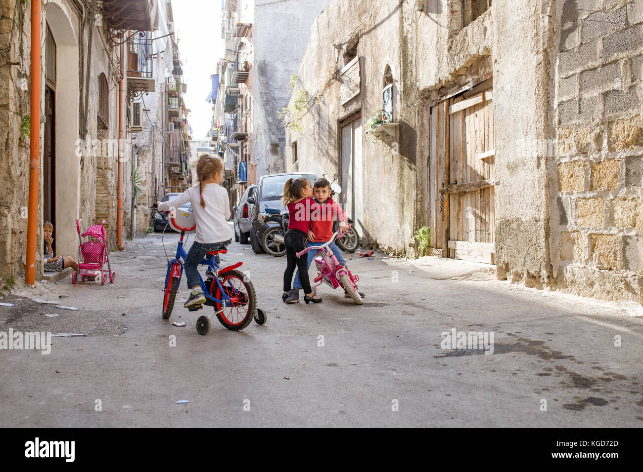 Kids playing on the streets of Palermo, a Sicilian city. November 2016 ...