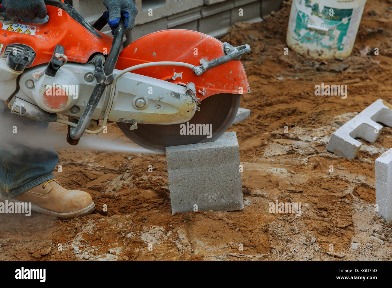 hand of stone mason cutting sandstone by industrial circular saw blades ...