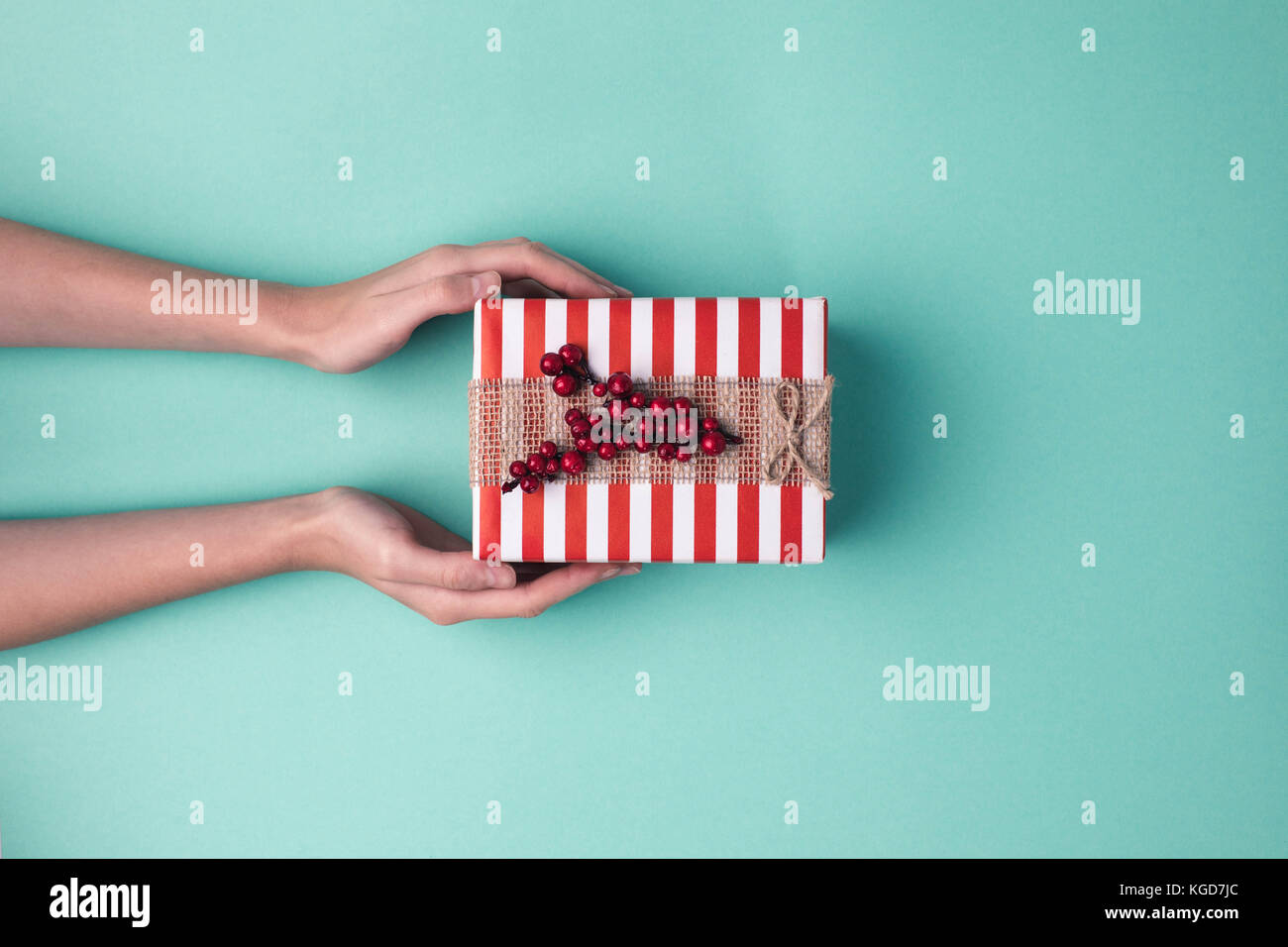 hands holding christmas gift Stock Photo - Alamy