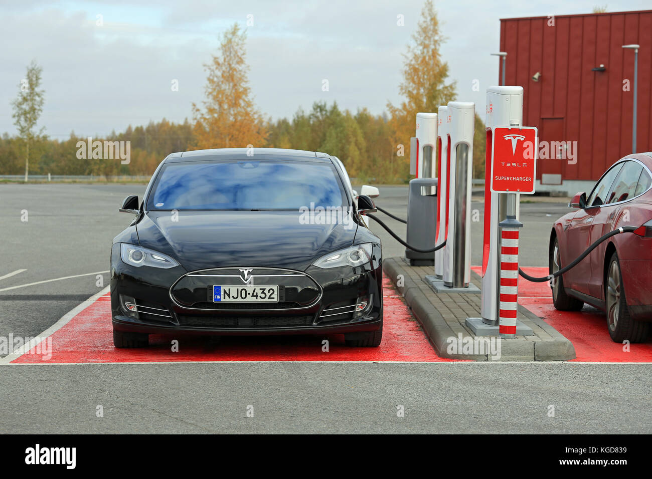 TOIJALA, FINLAND - OCTOBER 17, 2015: Three Tesla Model S cars are ...