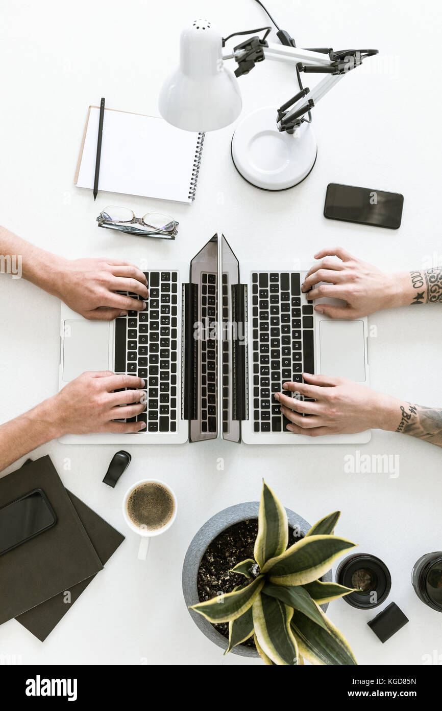 Two hands typing overhead hi-res stock photography and images - Alamy