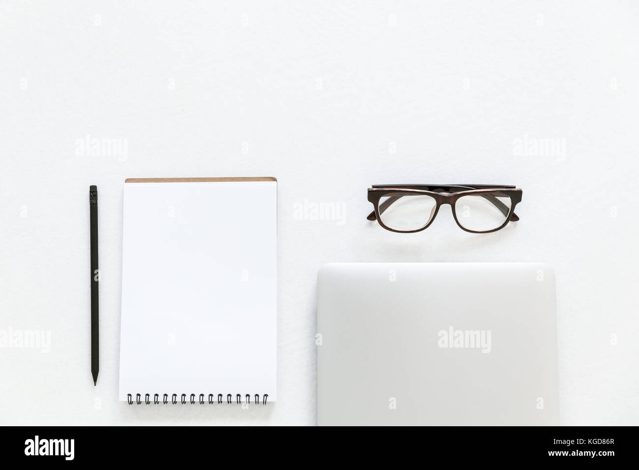 Laptop, glasses and notepad Stock Photo - Alamy