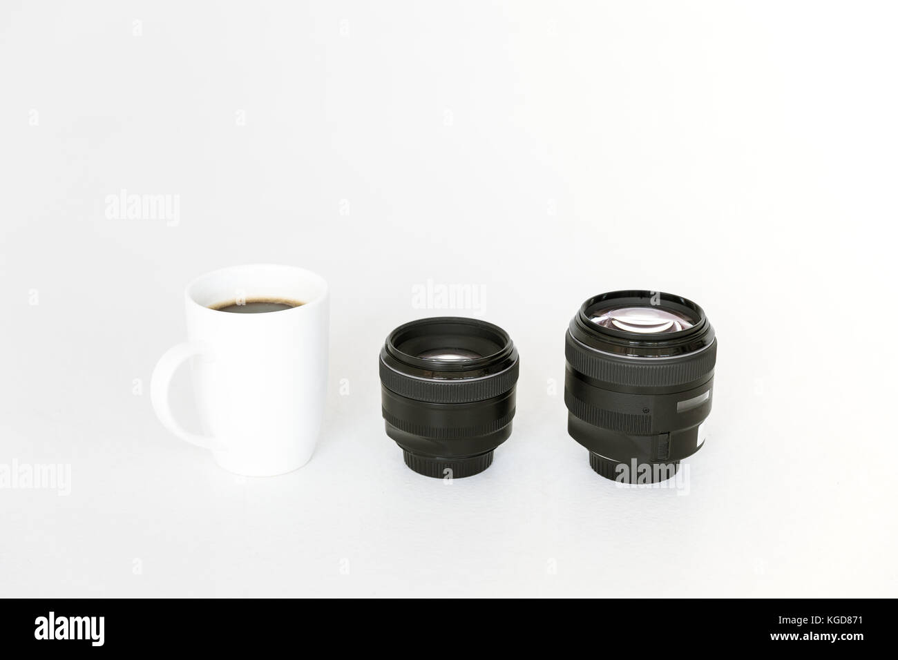 lenses and coffee mug Stock Photo - Alamy