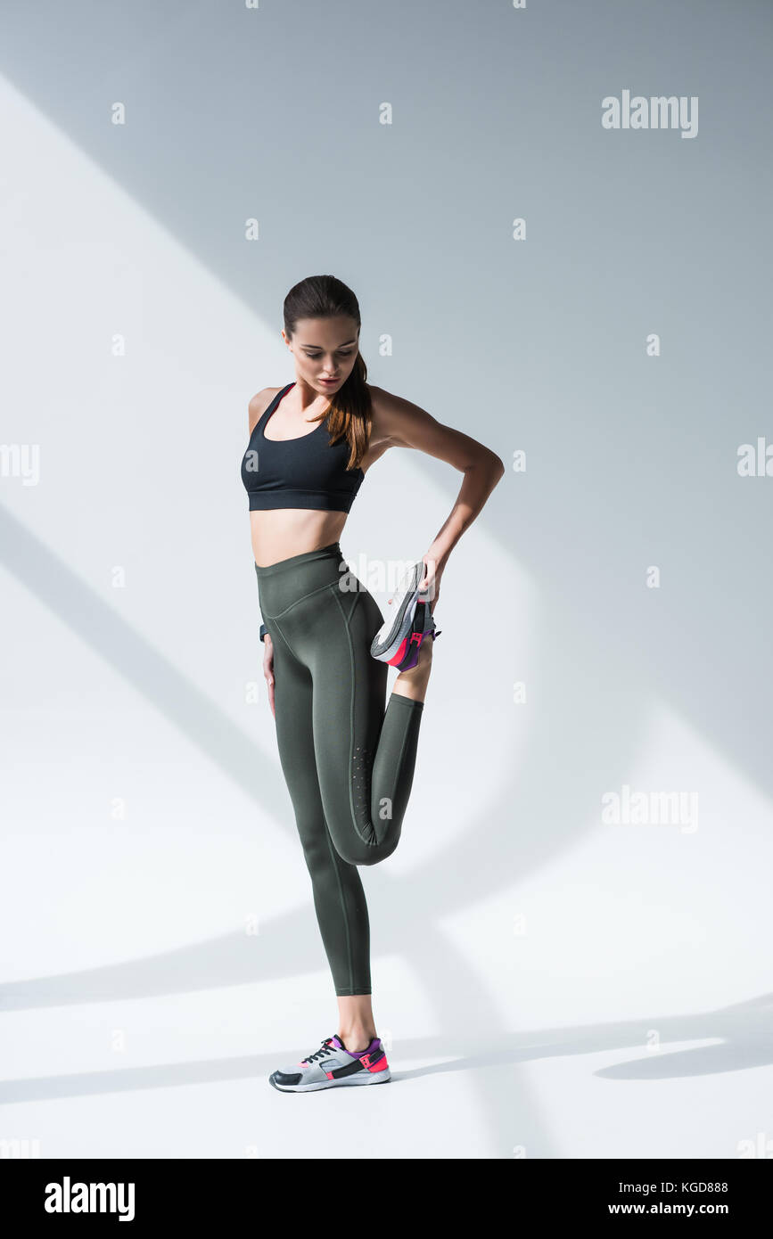 woman stretching before workout Stock Photo - Alamy