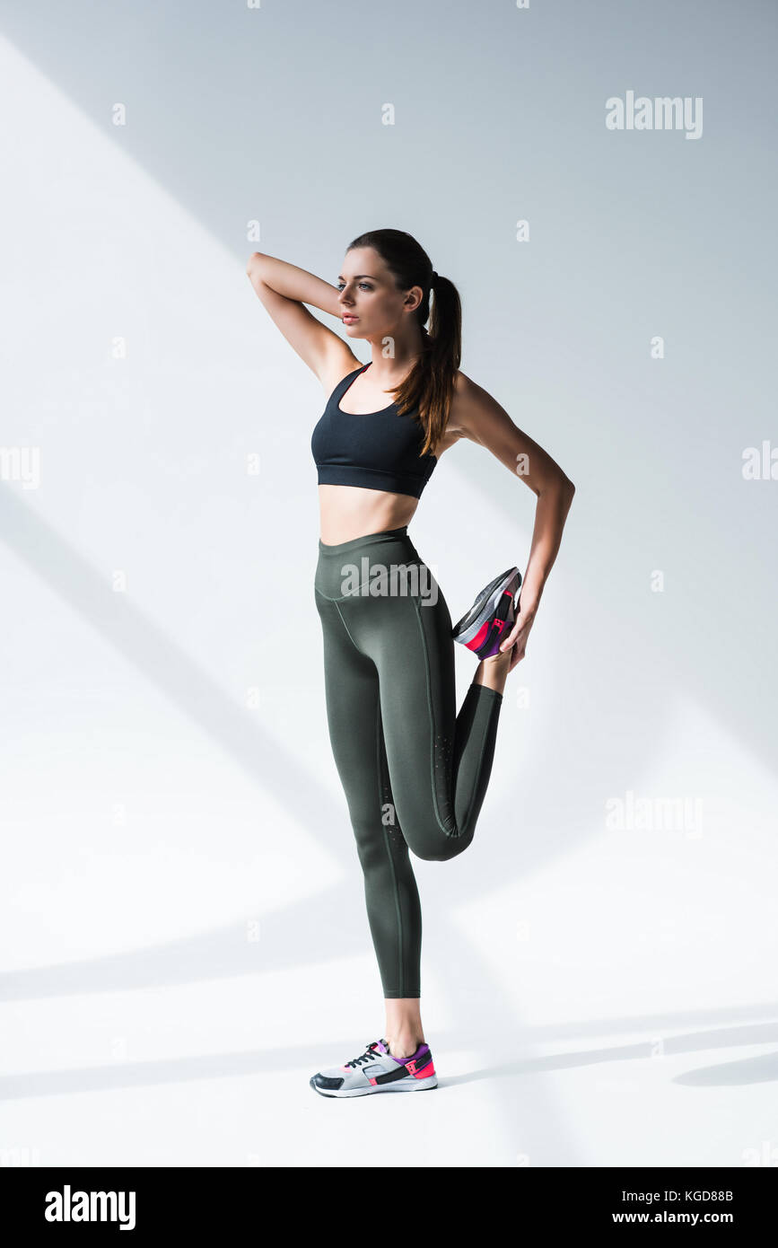 woman stretching before workout Stock Photo - Alamy