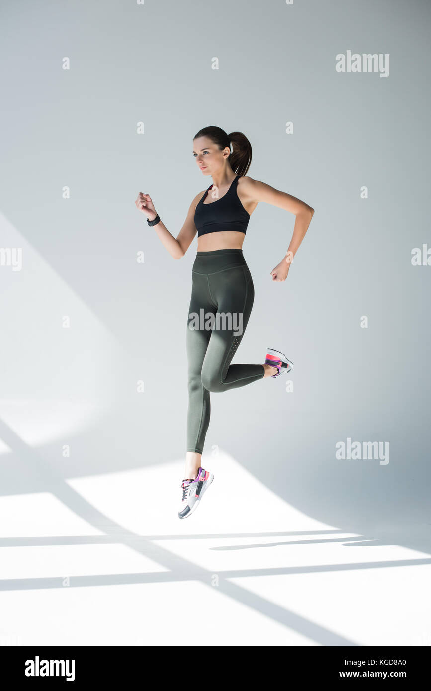 jumping girl in sportswear Stock Photo - Alamy