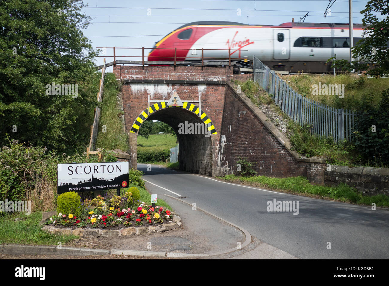 Virgin high speed train crossing over road bridge Stock Photo - Alamy